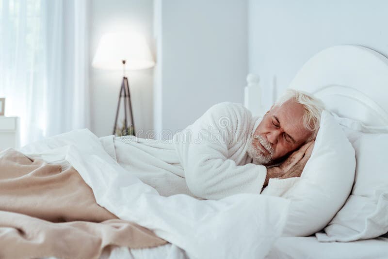 Relaxed Senior Man Sleeping Stock Photo - Image of home, indoors: 120328852