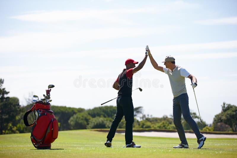 Good Shot Buddy. Shot of Two Happy Men Playing a Game of Golf. Stock ...
