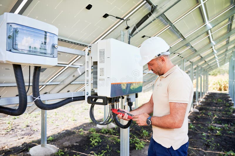Male Worker Checking If Solar Inverter Working Right. Stock Photo ...