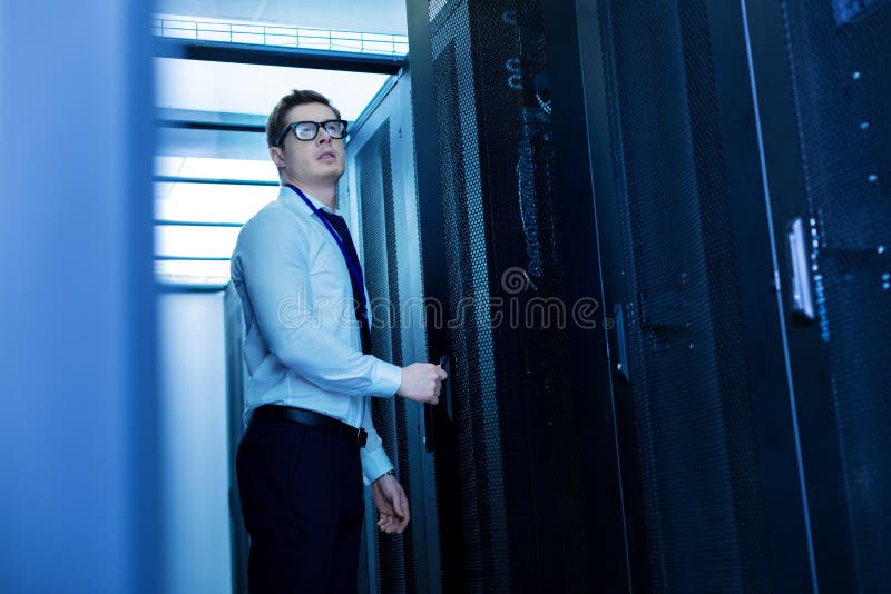 Serious Worker Standing in the Office Stock Image - Image of electronic ...