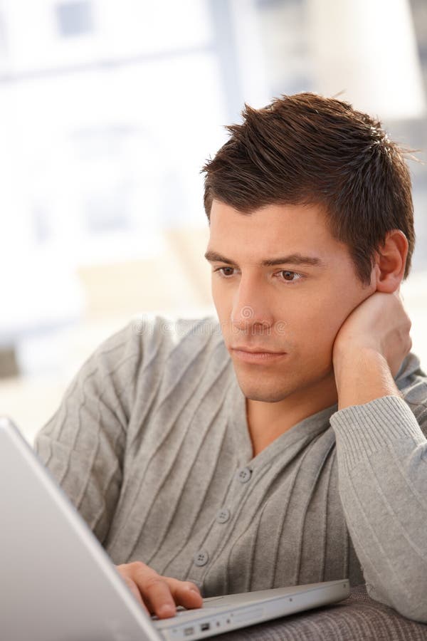 Goodlooking Guy Using Laptop Stock Image - Image of cosy, concentrating ...