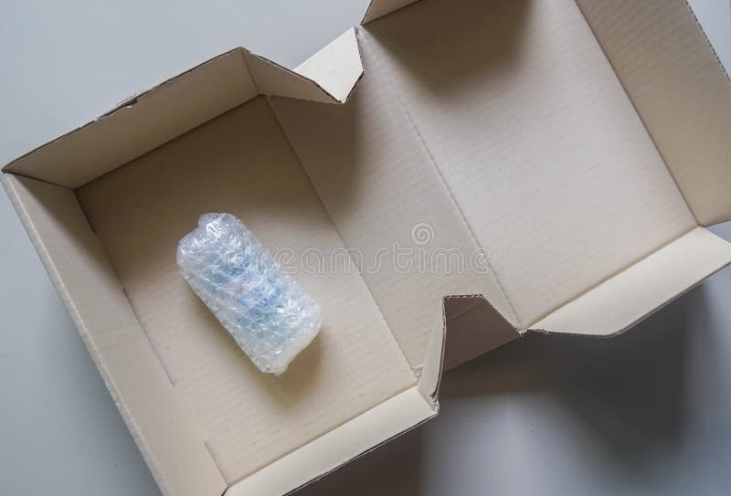 Goods in Bubble Wrapping Sheet in Cardboard Carton for Shipment Stock ...