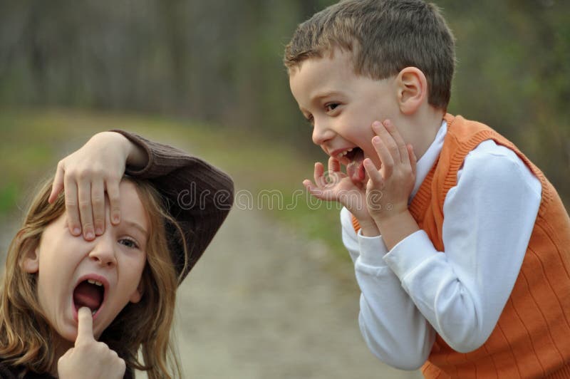 Goofy faces in autumn stock photo. Image of female, brother - 11822528