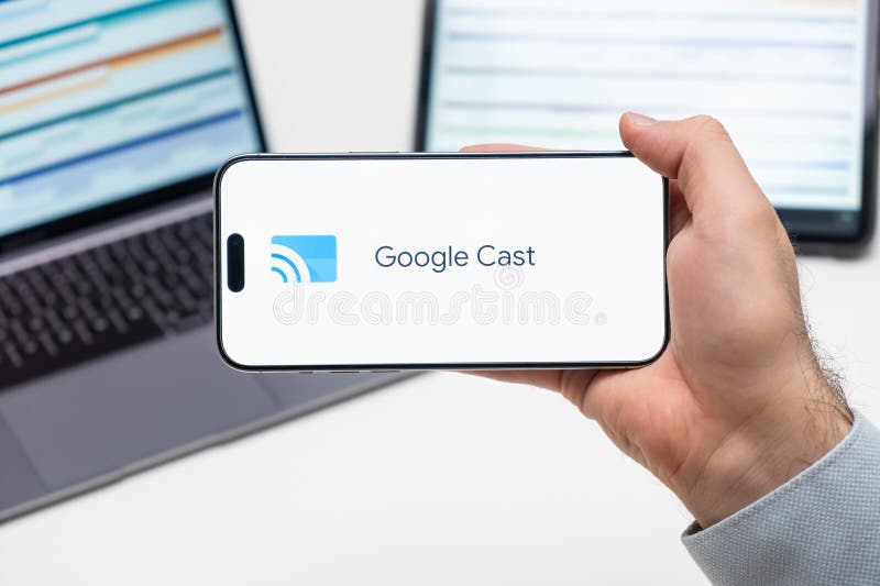 Google Cast Logo of App on the Screen of Mobile Phone Held by Man in ...
