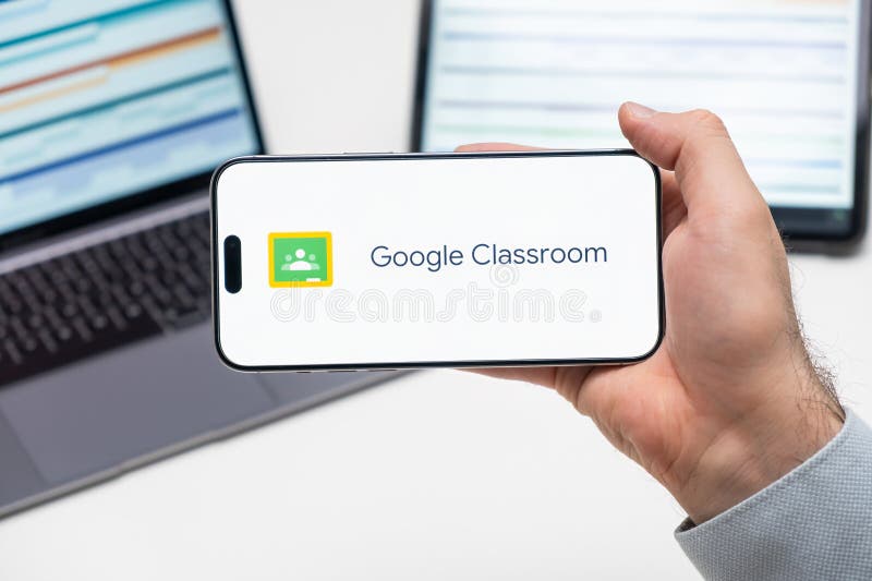 Google Classroom Application Logo on the Screen of Smart Phone in Mans ...
