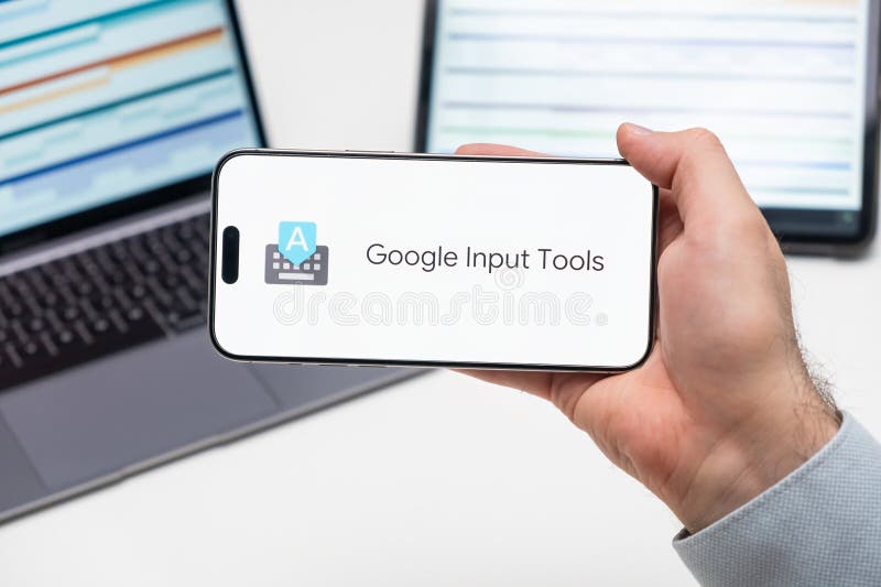 Google Input Tools Logo of App on the Screen of Mobile Phone Held by ...