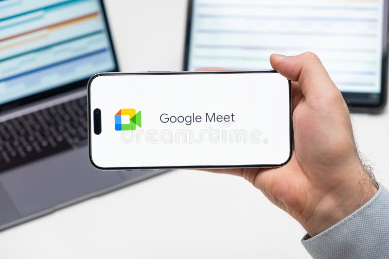 Google Meet Logo of App on the Screen of Mobile Phone Held by Man in ...