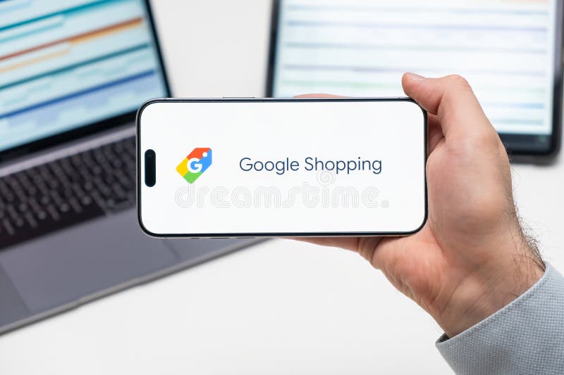 Google Shopping Logo of App on the Screen of Mobile Phone Held by Man ...