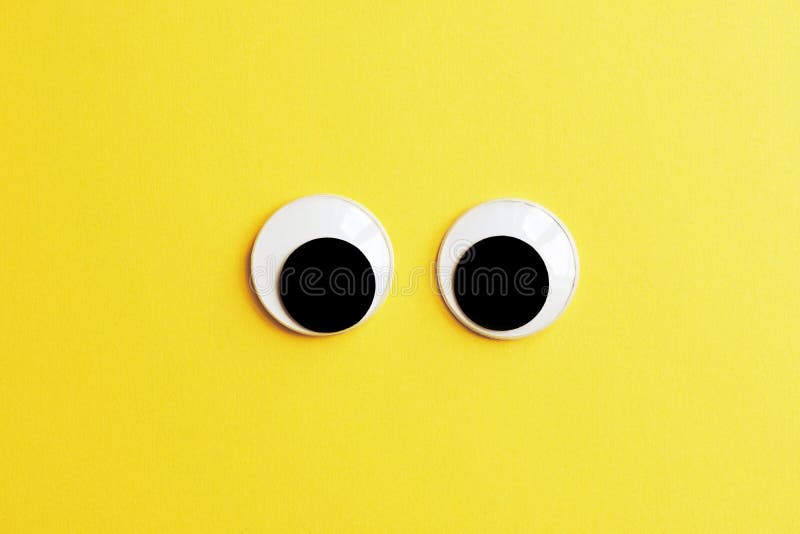 Googly Eyes on Yellow Color Background Stock Image - Image of ...