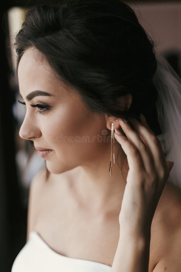 Gorgeous Bride Putting On Luxury Earrings Beautiful Woman Portrait Of