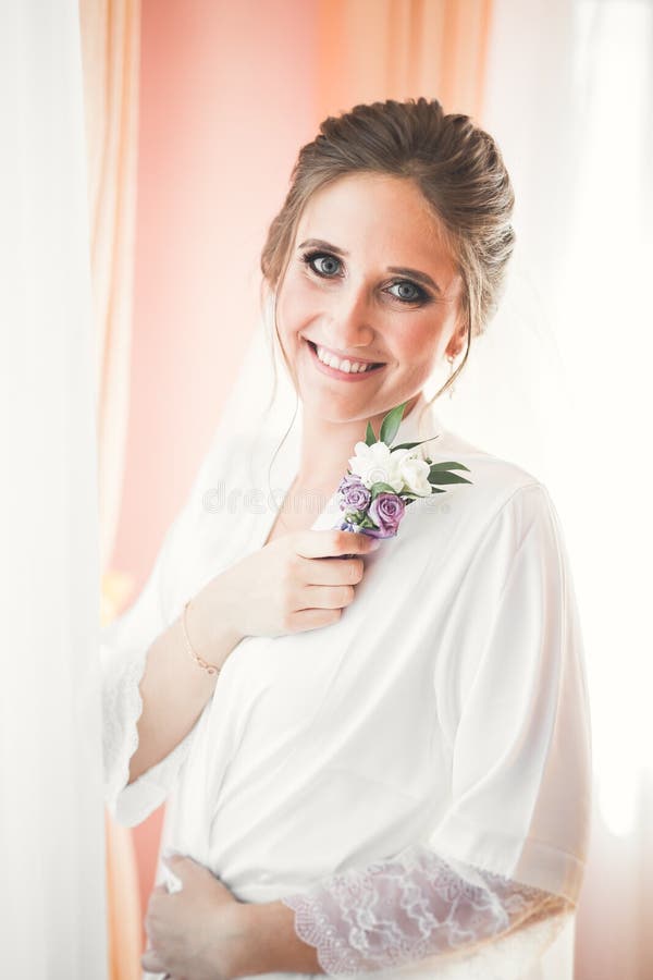 Gorgeous Bride in Robe Posing and Preparing for the Wedding Ceremony ...