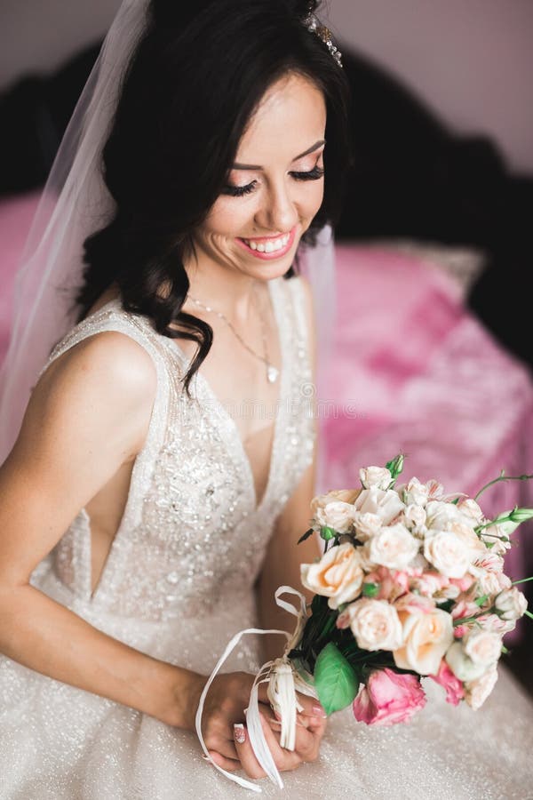 Gorgeous Bride in Robe Posing and Preparing for the Wedding Ceremony ...