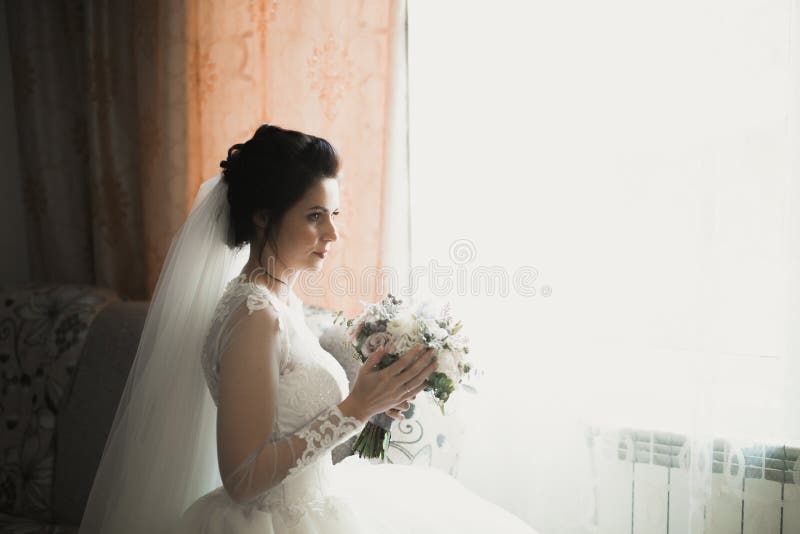 Gorgeous Bride in Robe Posing and Preparing for the Wedding Ceremony ...