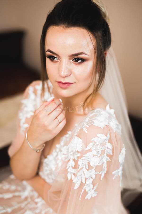 Gorgeous Bride in Robe Posing and Preparing for the Wedding Ceremony ...