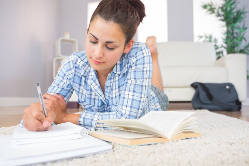 Gorgeous Brunette Student Doing Homework Lying on the Floor Stock Image ...