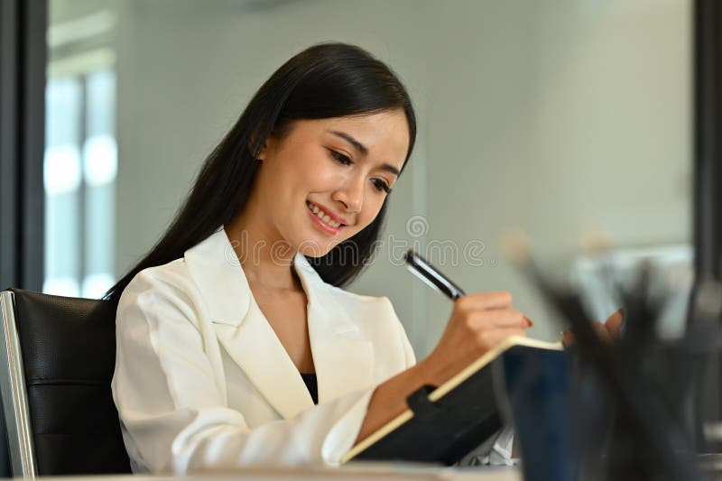 Gorgeous Female Manager Writing Idea for Startup Project or Reminder ...