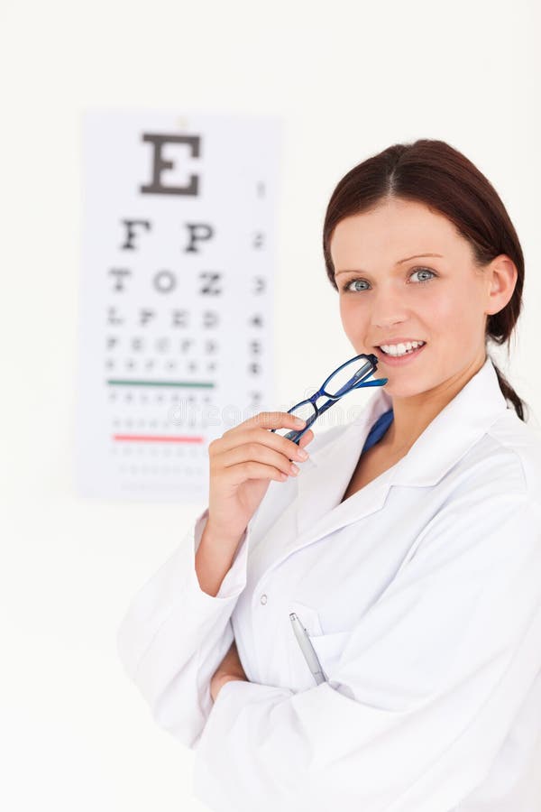 Gorgeous Female Optician with an Eye Test Stock Image - Image of ...