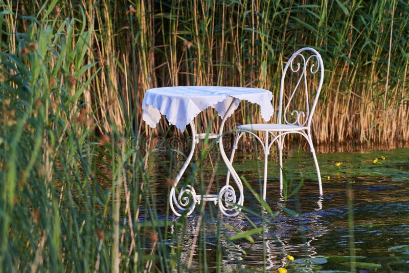 Gorgeous Retro Table and Chair on the Lake Water Stock Image - Image of ...