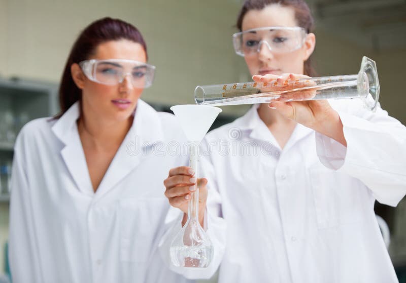 Gorgeous Scientists Doing an Experiment Stock Image - Image of ...