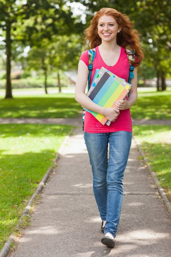 Gorgeous Smiling Student Walking and Carrying Notebooks Stock Photo ...