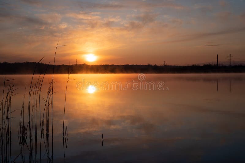 Gorgeous Sunrise Over the Lake with Reflection of the Sun on the Lake ...