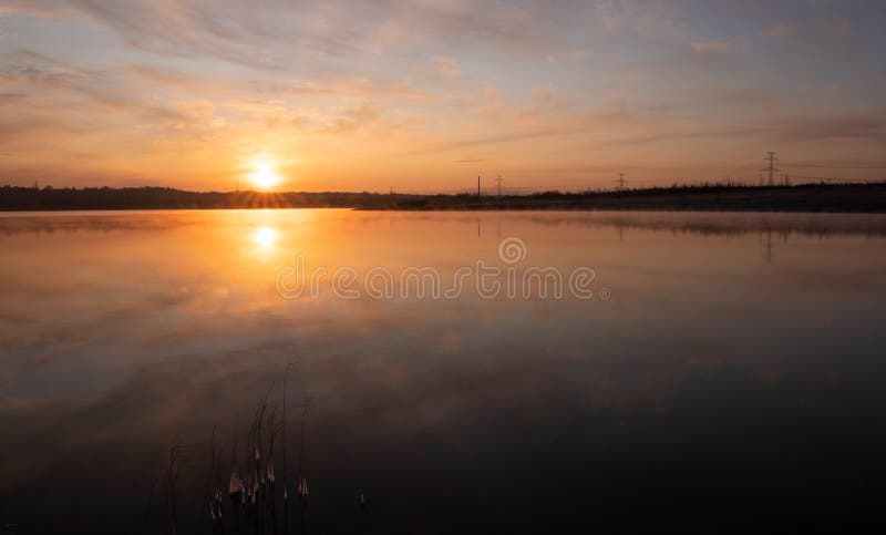 Gorgeous Sunrise Over the Lake with Reflection of the Sun on the Lake ...