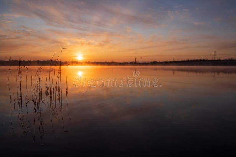 Gorgeous Sunrise Over the Lake with Reflection of the Sun on the Lake ...