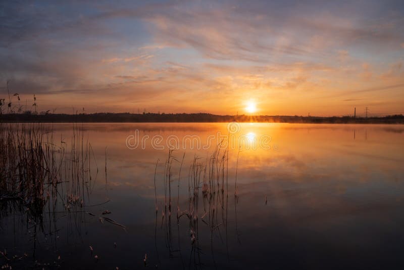 Gorgeous Sunrise Over the Lake with Reflection of the Sun on the Lake ...