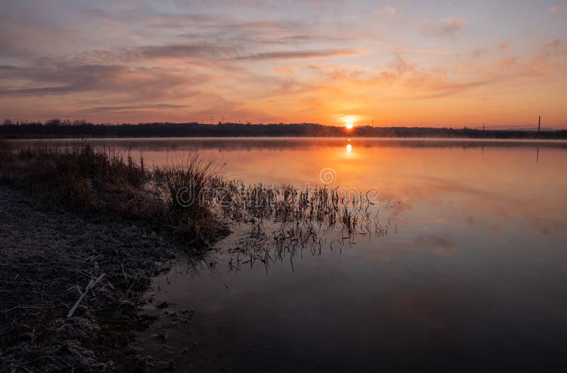 Gorgeous Sunrise Over the Lake with Reflection of the Sun on the Lake ...