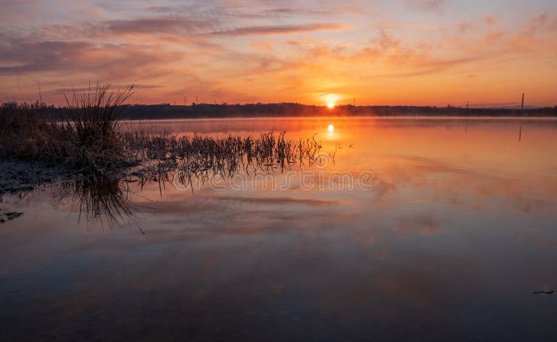 Gorgeous Sunrise Over the Lake with Reflection of the Sun on the Lake ...