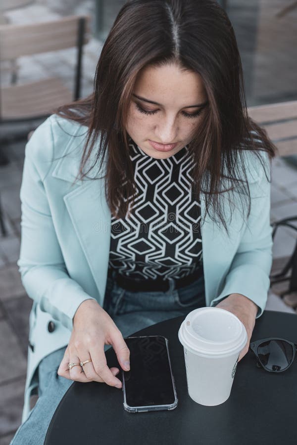 Searching Something on Her Phone while Drinking a Coffee Stock Image ...