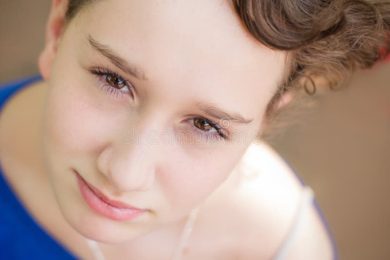 Gorgeous Young Girl Looking Up at the Camera. Stock Image - Image of ...