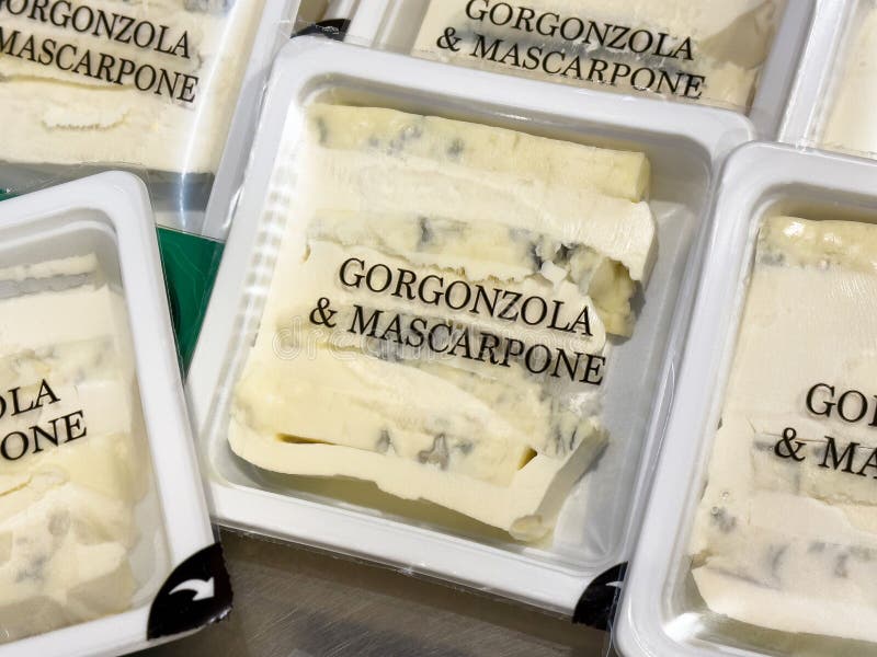 Gorgonzola and Mascarpone Cheese Slices in Plastic Packaging Editorial ...