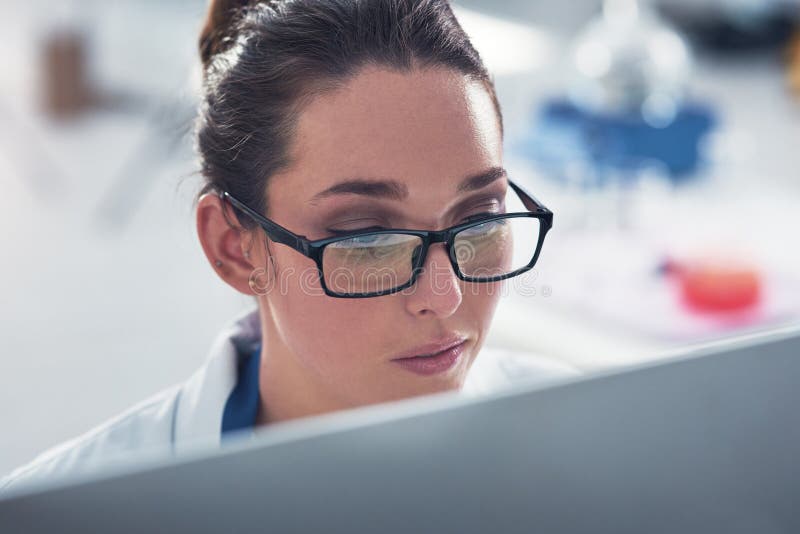 Got To Check the Data. a Focused Young Female Scientist Working on a ...