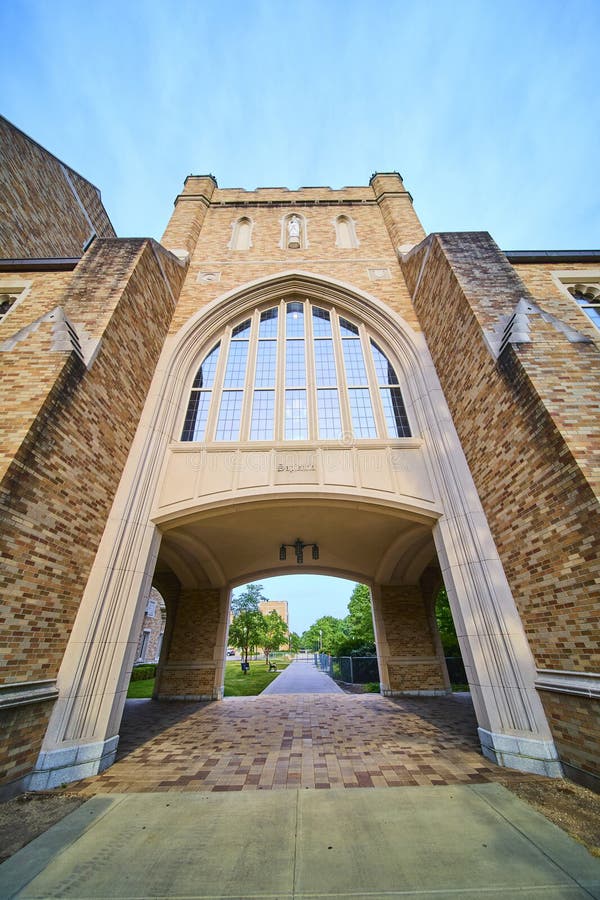 Gothic Gateway Architecture with Tree-Lined Path from Low Angle ...