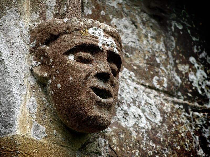 Gothic Stone Faces Next To a Church Window Stock Image - Image of decor ...