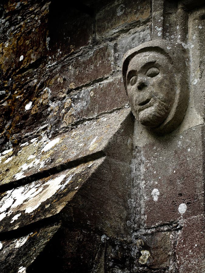Gothic Smiley Stone Face On A Church Wall Stock Image - Image of creepy ...