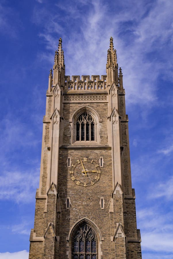 Gothic Tower in Front of Bright Blue Sky with White Cirrus Clouds Stock ...