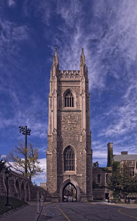 Gothic Tower in Front of Bright Blue Sky with White Cirrus Clouds Stock ...