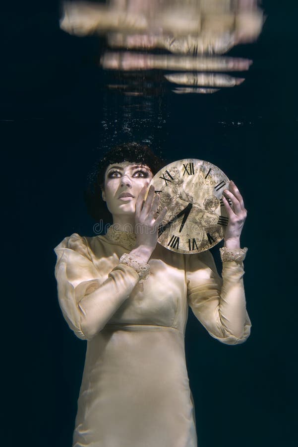 Gothic Woman with Clock in Her Hands in Black Veil Underwater Stock ...