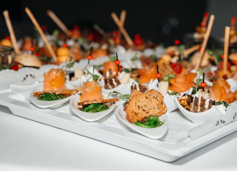 Gourmet Appetizer Selection with Smoked Salmon and Veggies on Elegant ...