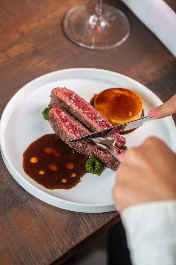 Gourmet Beef Steak with Elegant Garnish in Fine Dining Setting Stock ...