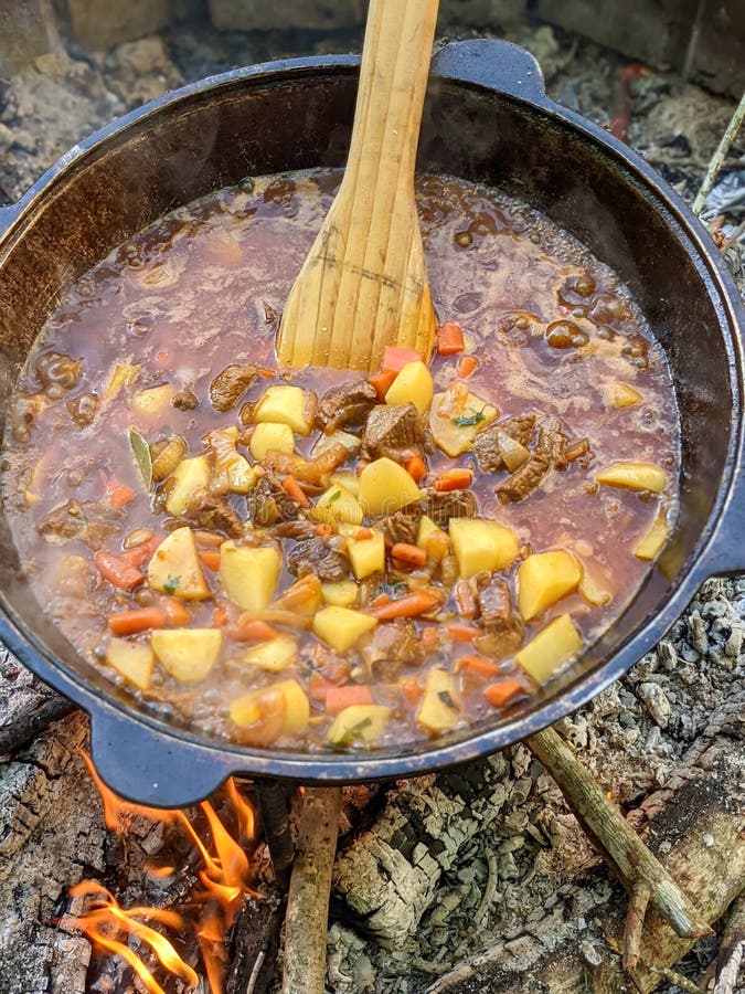 Gourmet Beef Stew Cooked in Cauldron on Outdoor Fire Pit Stock Photo ...