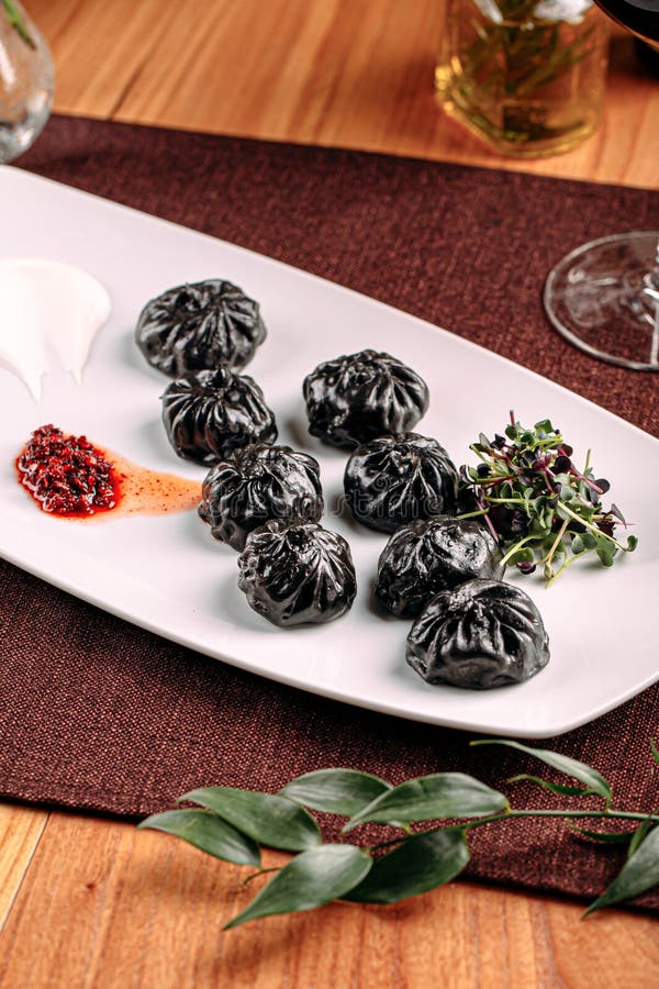 Gourmet Black Burger with Juicy Beef Patty and Fresh Vegetables Stock ...