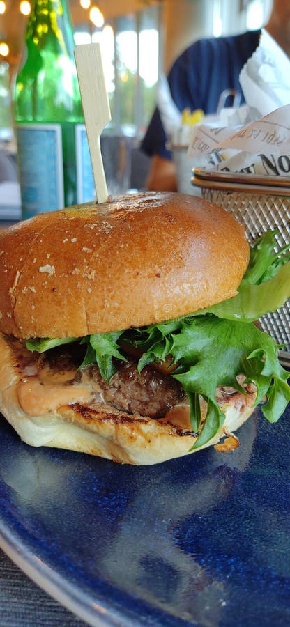 Gourmet Burger Plated Meal on the Table in Restaurant Stock Photo ...