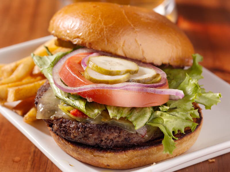 American Cheeseburger with Fries Stock Photo - Image of real, sandwich ...
