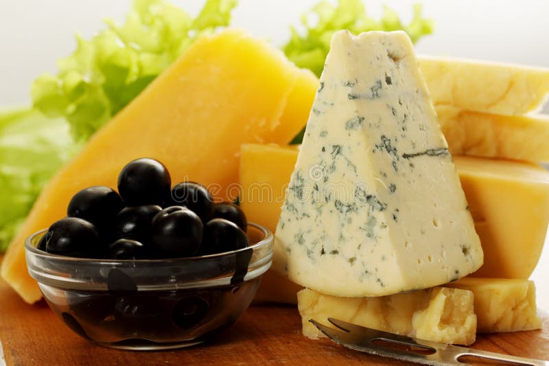 Gourmet cheeses and olives stock photo. Image of appetizer - 34920816