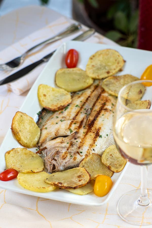 Gourmet Cooked Fish with Lemon and Herbs Stock Photo - Image of dining ...