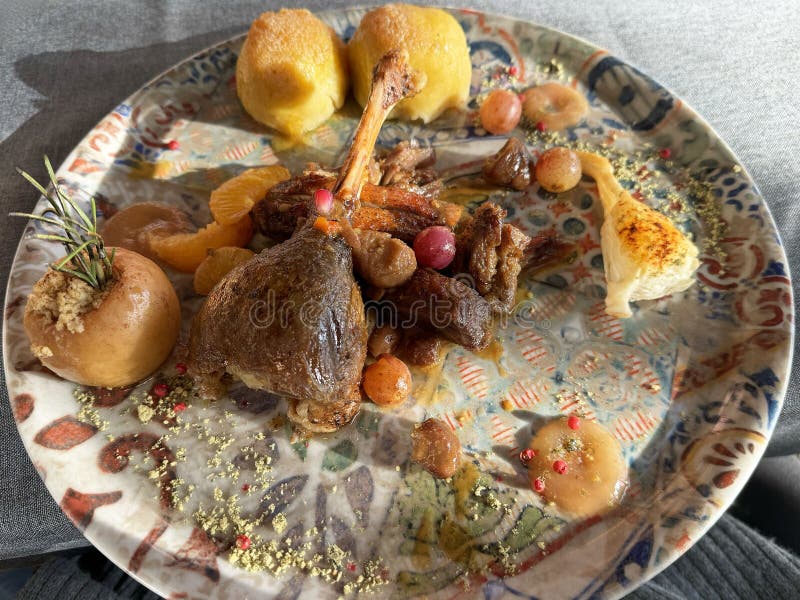 Gourmet Duck Leg Confit with Root Vegetables and Fruit on Artistic ...