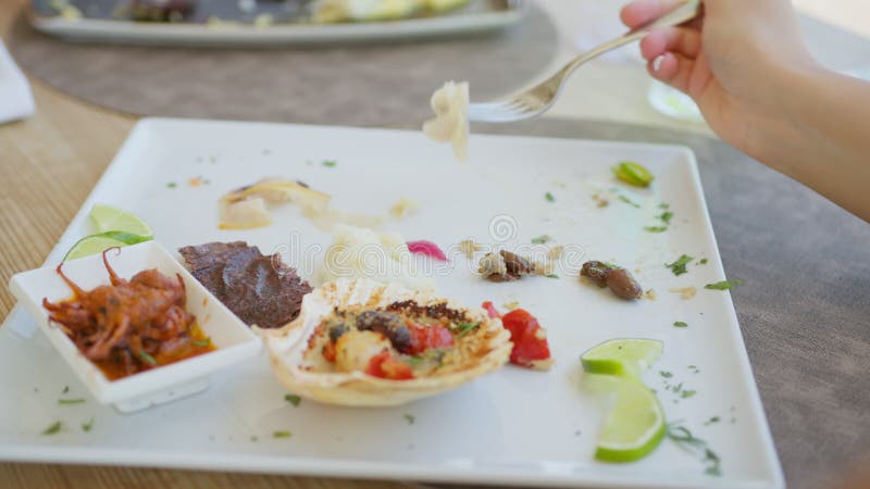 Gourmet Fish Appetizer is almost Finished Inside the Dish at Restaurant ...
